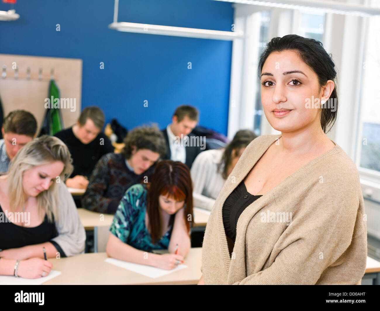 Teacher in classroom Stock Photo - Alamy