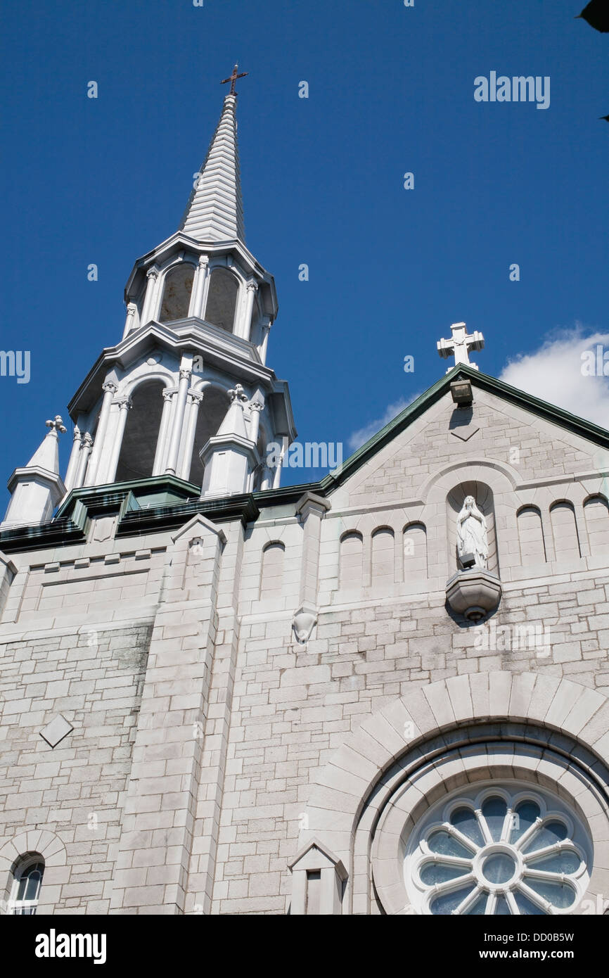 A Steeple Cross And Circular Window On A Catholic Church; Marieville ...