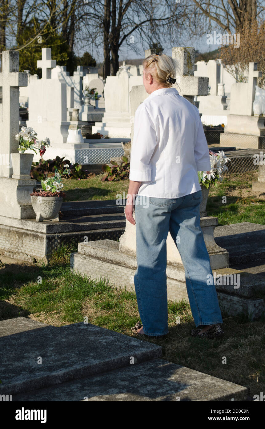 woman walks through an cemetery Stock Photo - Alamy