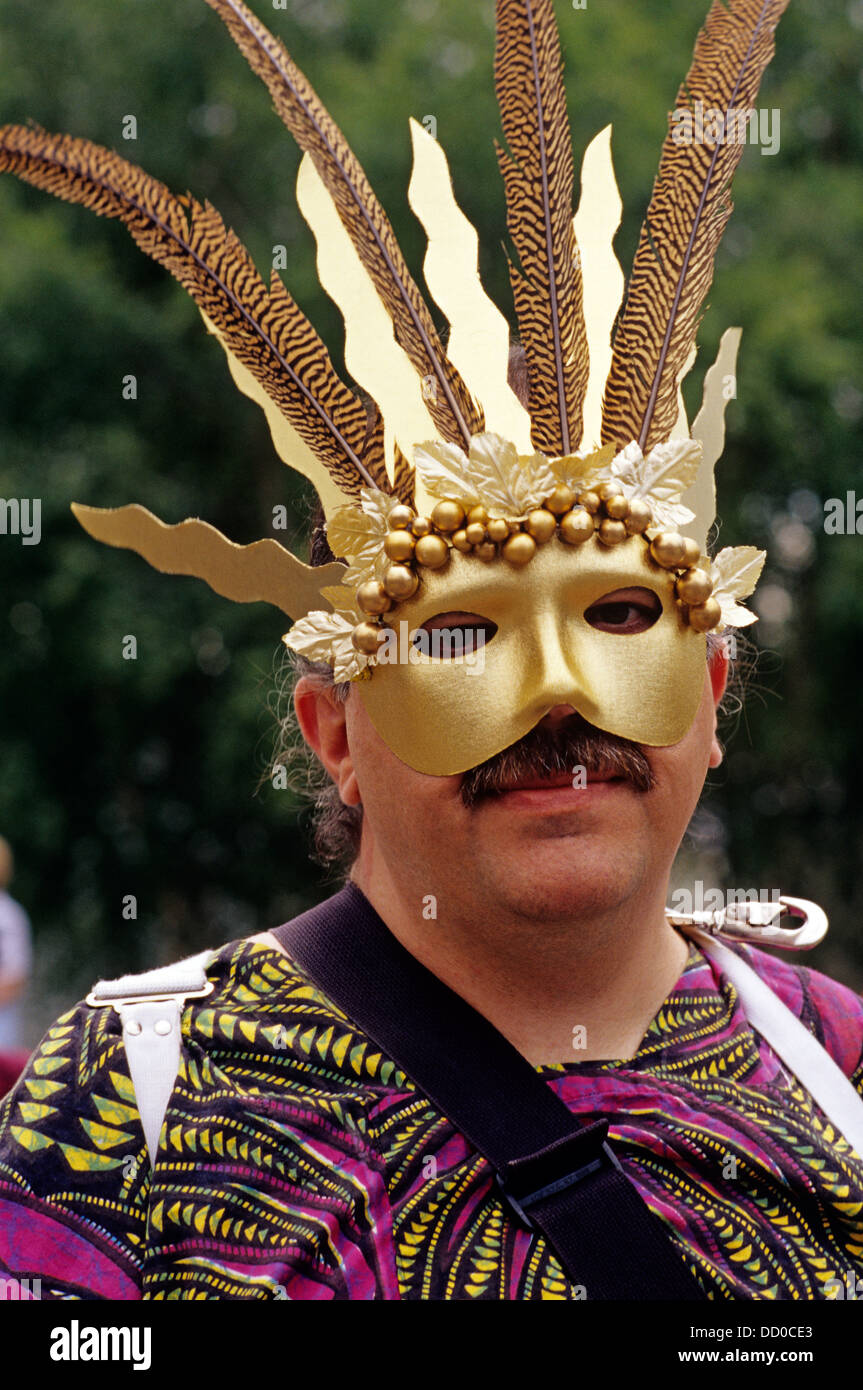 Man in mask and costume performing at the Fremont Parade Seattle ...