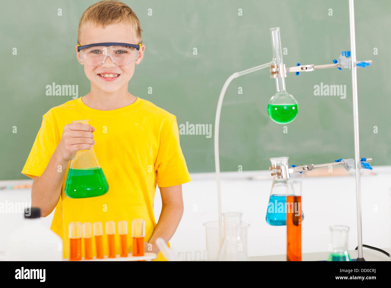 male elementary school student in the lab holding a flask Stock Photo ...