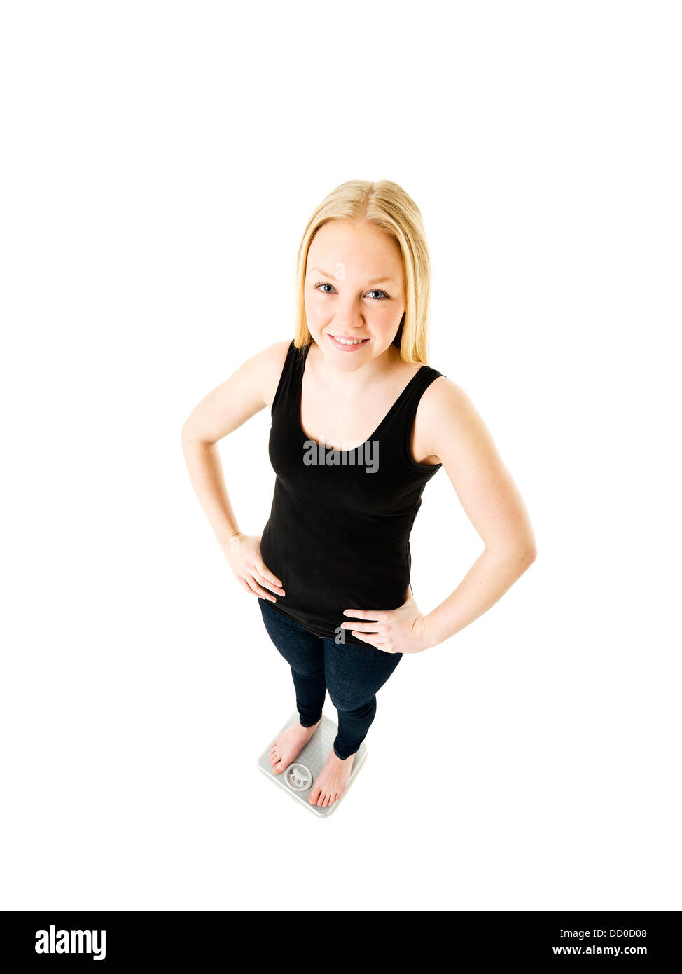 Girl on weight scale Stock Photo - Alamy