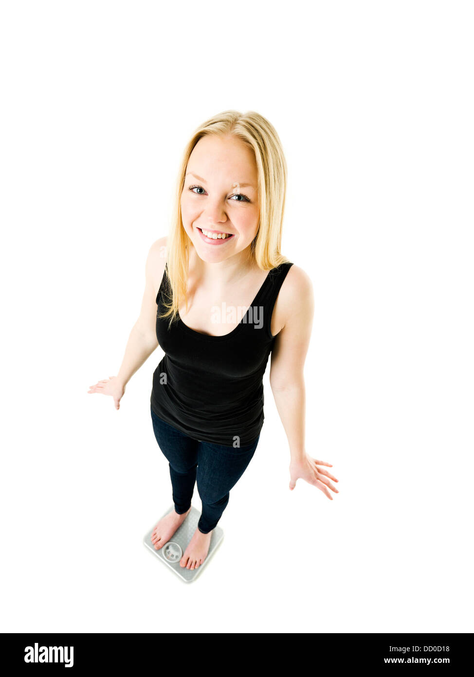 Girl on weight scale Stock Photo - Alamy