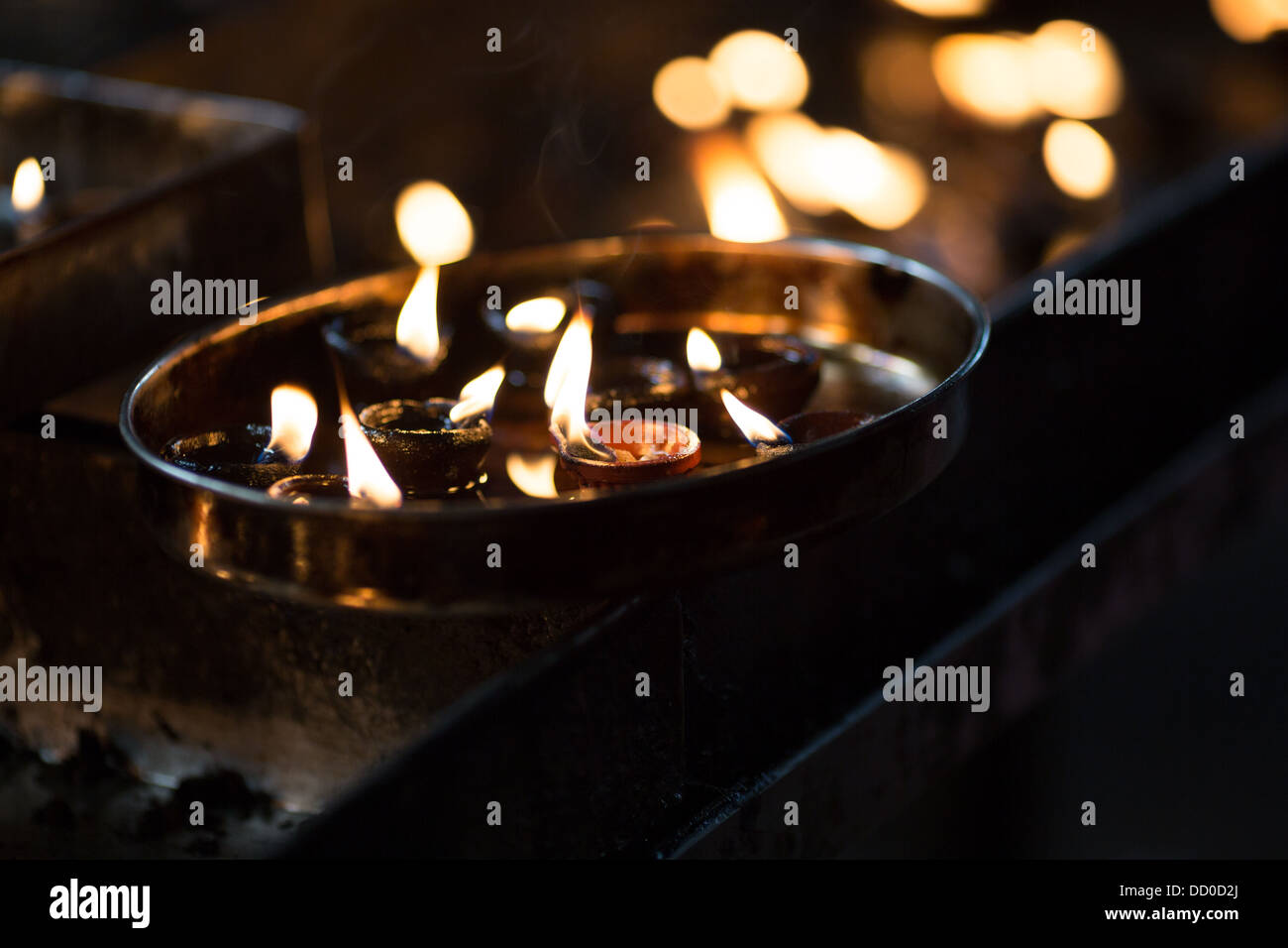Buddhist oil lamp lights hi-res stock photography and images - Alamy