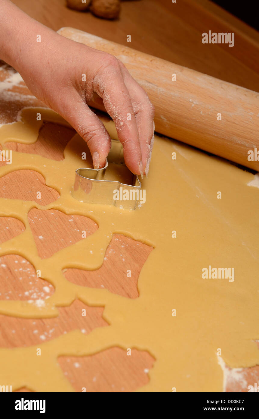Christmas bakery background with baking tin, cut out some cookies Stock ...