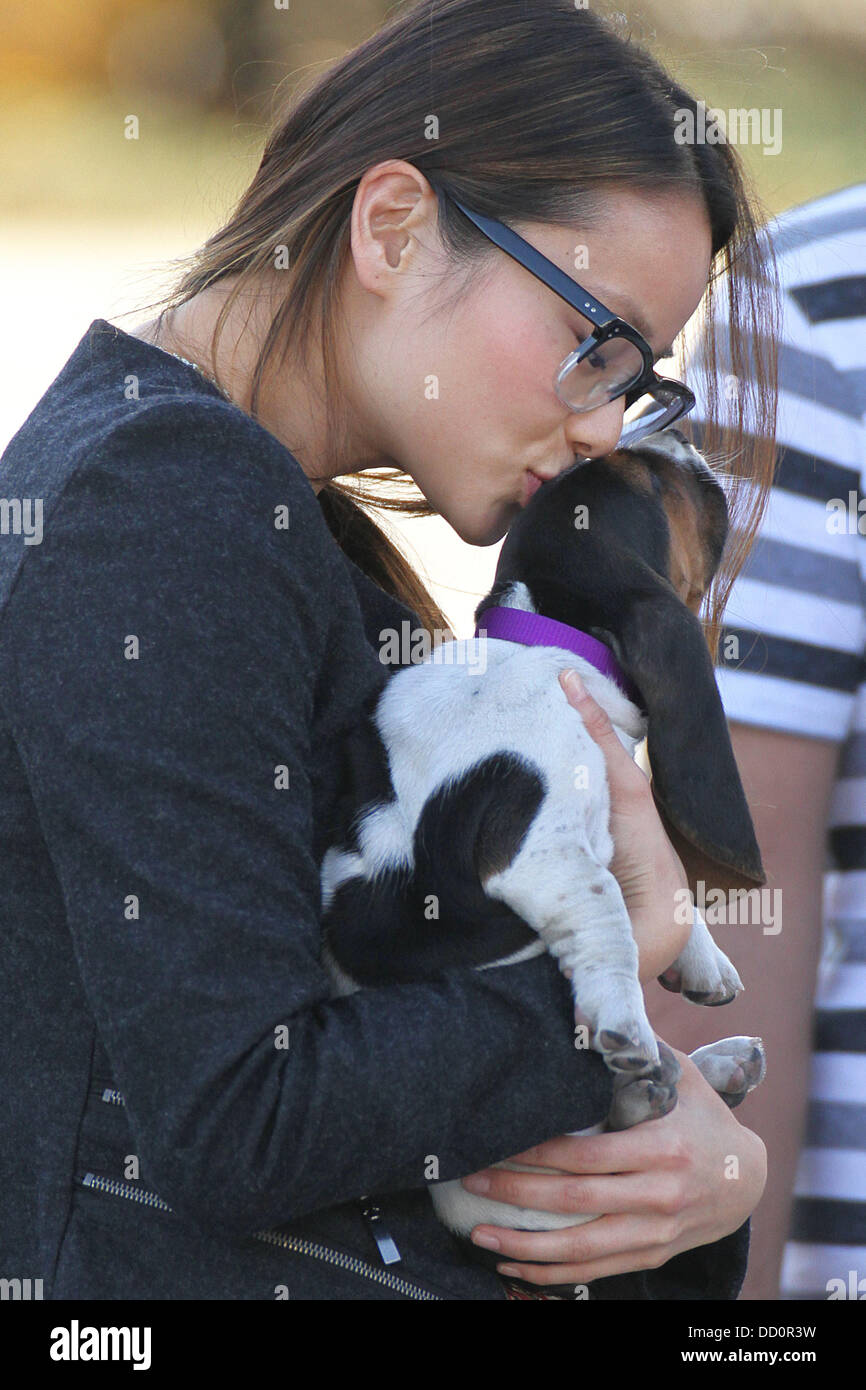 Jamie Chung cuddles a puppy after leaving a Tailors in West Hollywood ...
