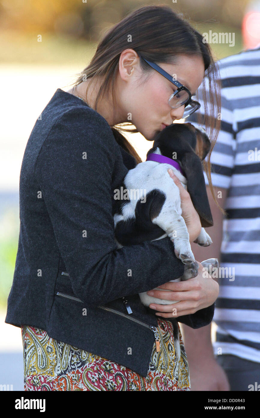 Jamie Chung cuddles a puppy after leaving a Tailors in West Hollywood ...