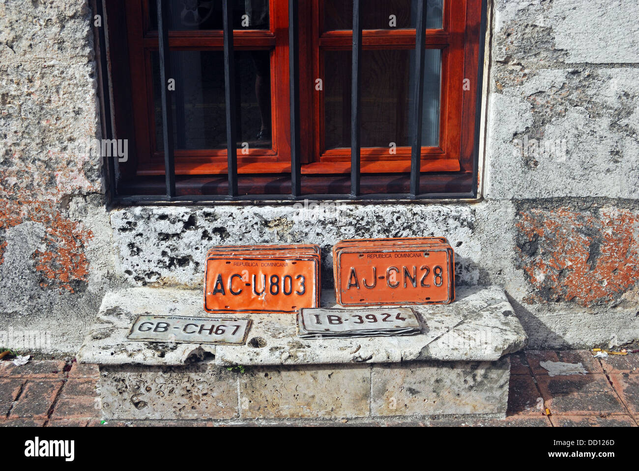 Number plates for sale on a stone step, Santo Domingo, Dominican ...