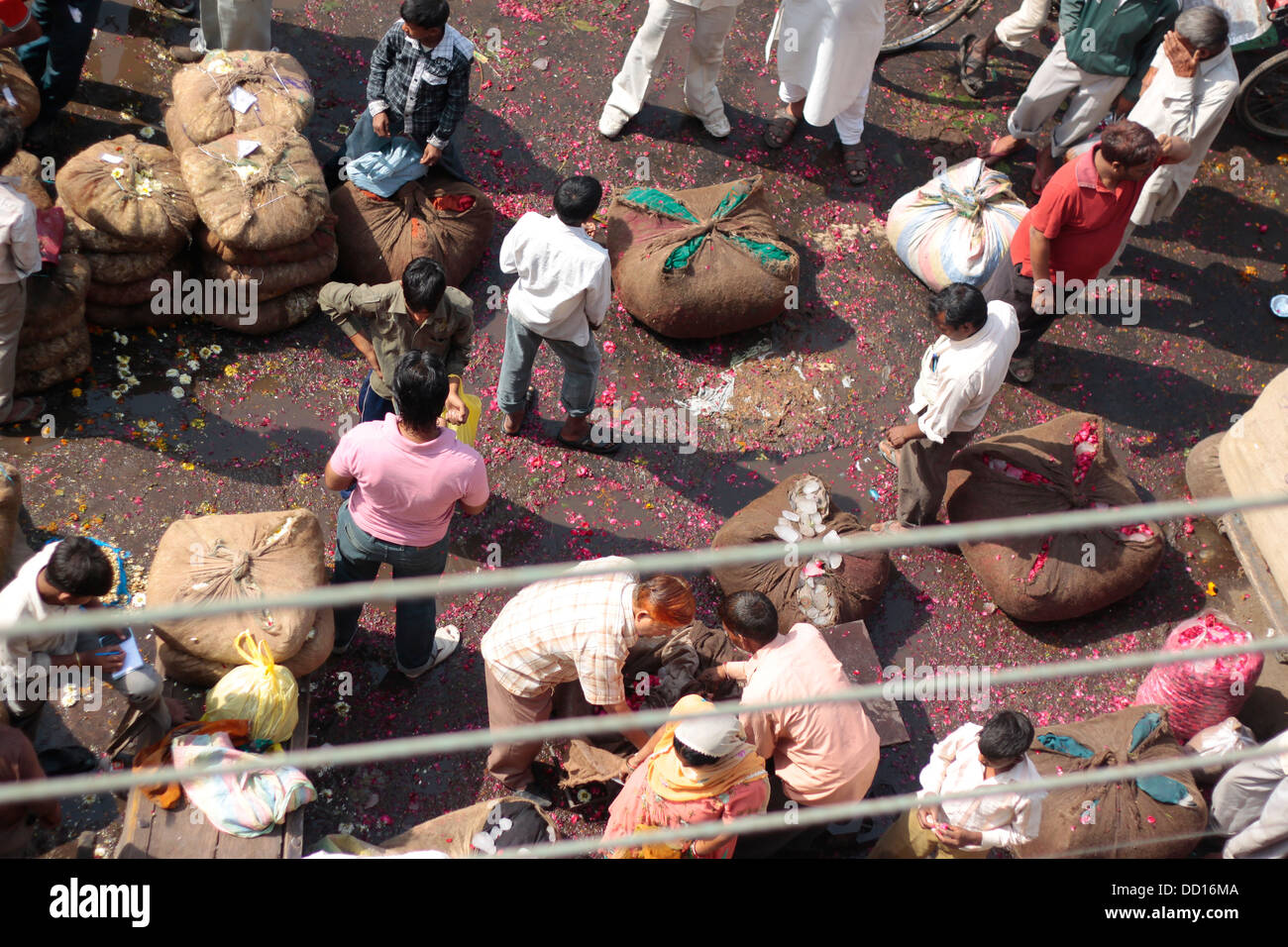 Flowers packed in gunny bags at the wholesale flower market at Chandni ...