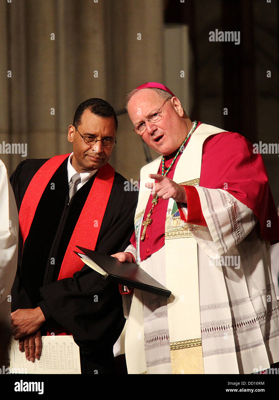 Rev Dr A.R.Bernard speaks to Cardinal Designate Timothy M Dolan, Archbishop of New York during a ...