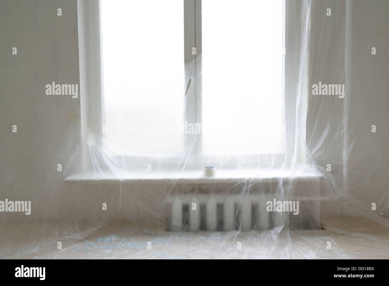 wall and window protected by plastic film in home renovation interior ...