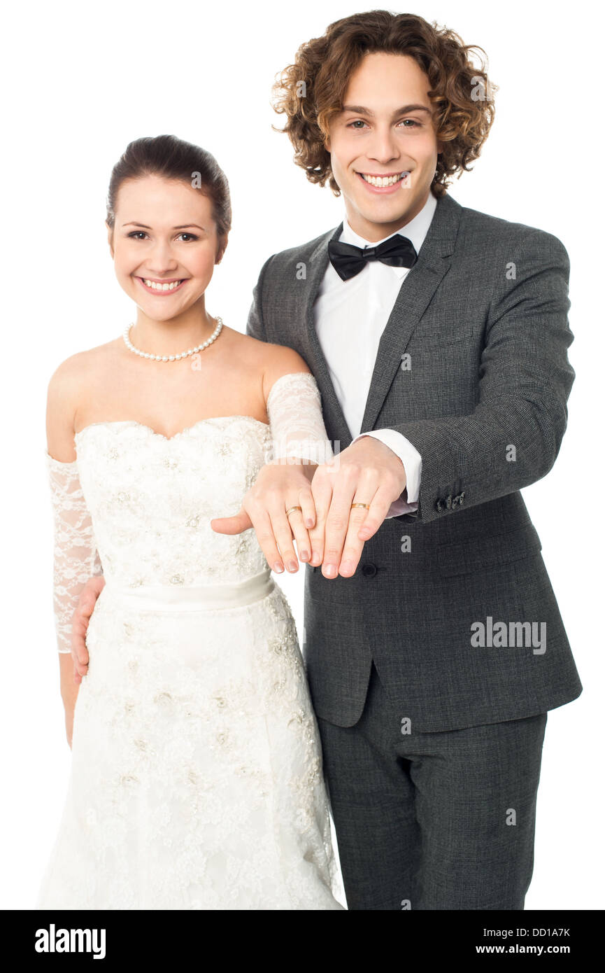 Happy bride and groom displaying their wedding rings Stock Photo - Alamy