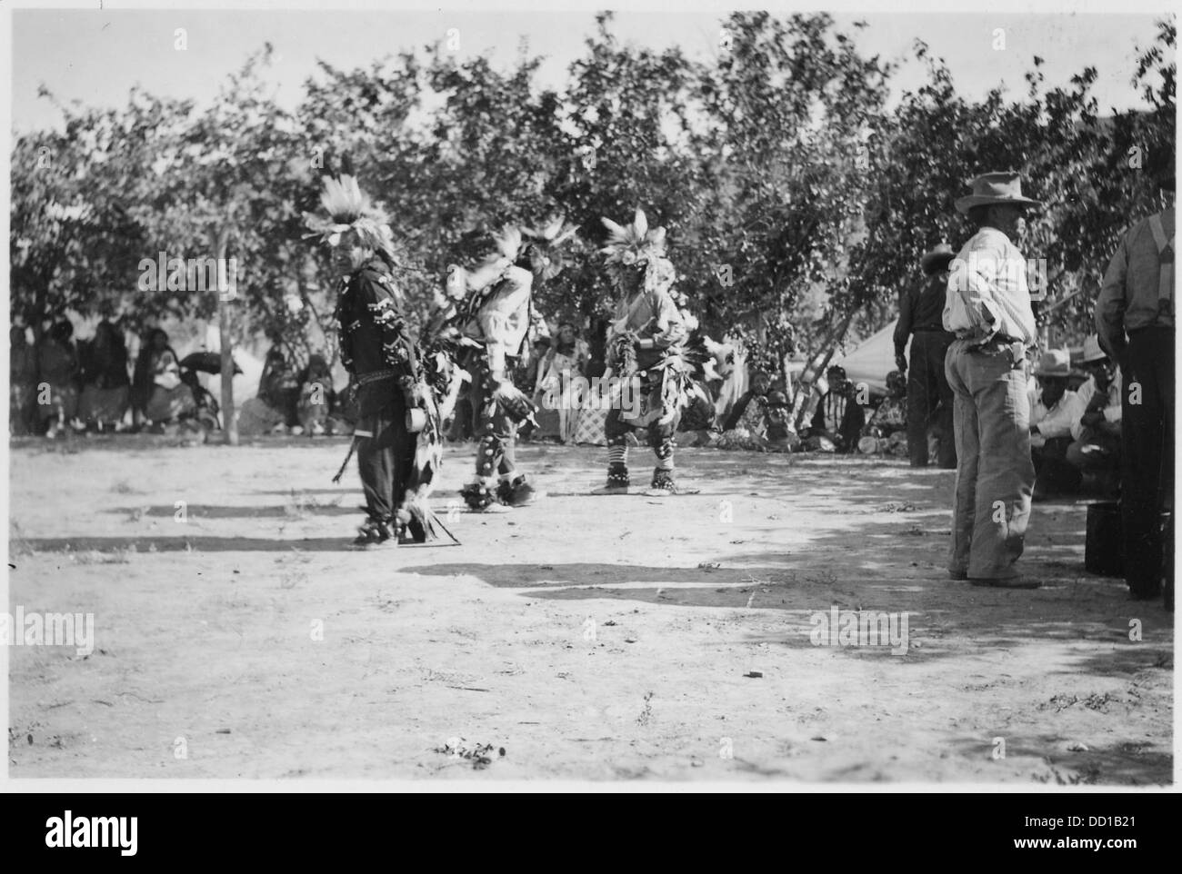 This image shows a group of Native dancers performing a traditional ...