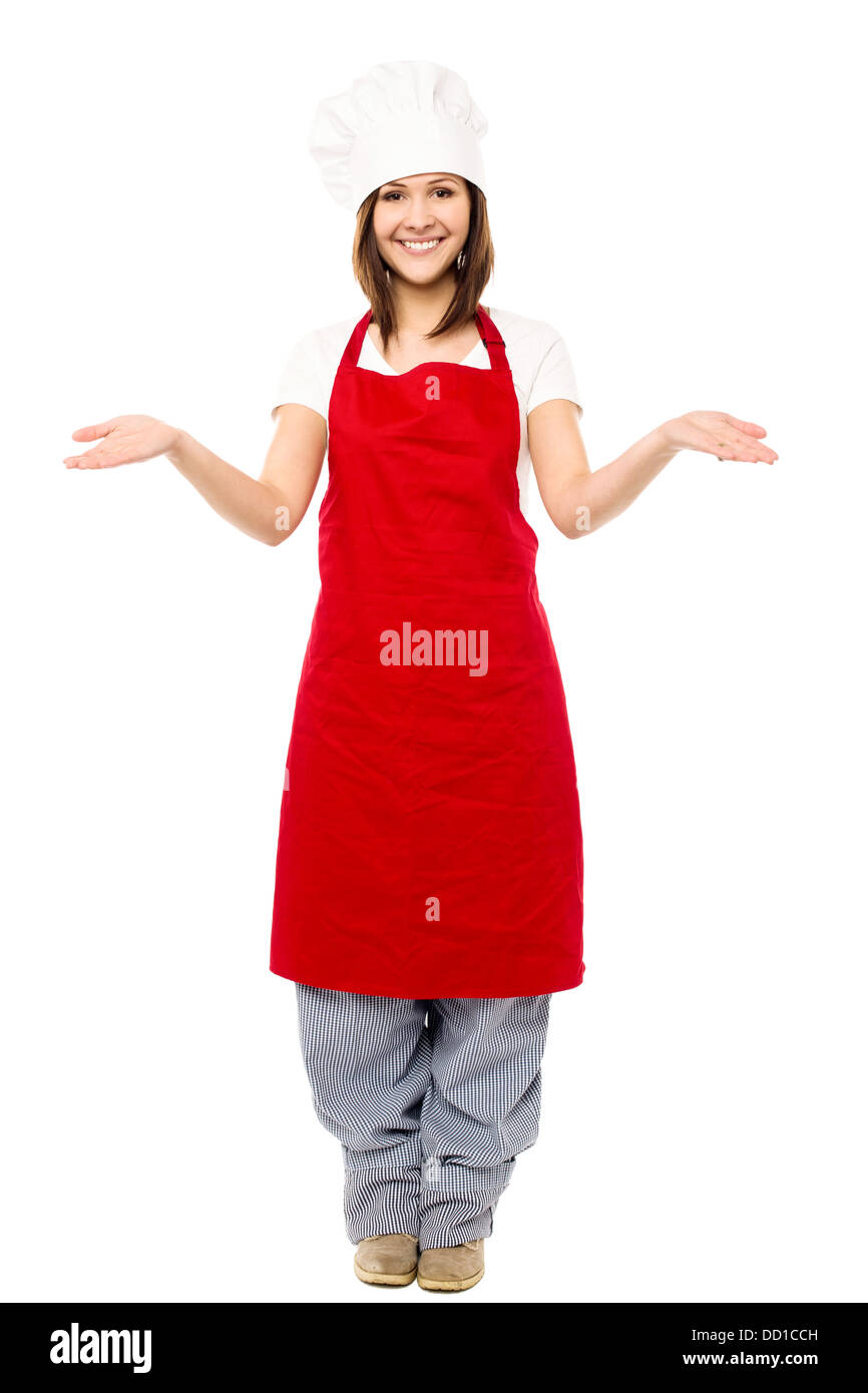 Full length image of charming young female chef Stock Photo - Alamy