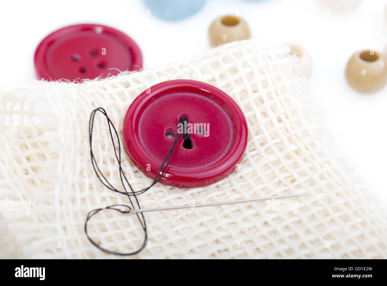 buttons, thread and needle. sewing accessories Stock Photo - Alamy