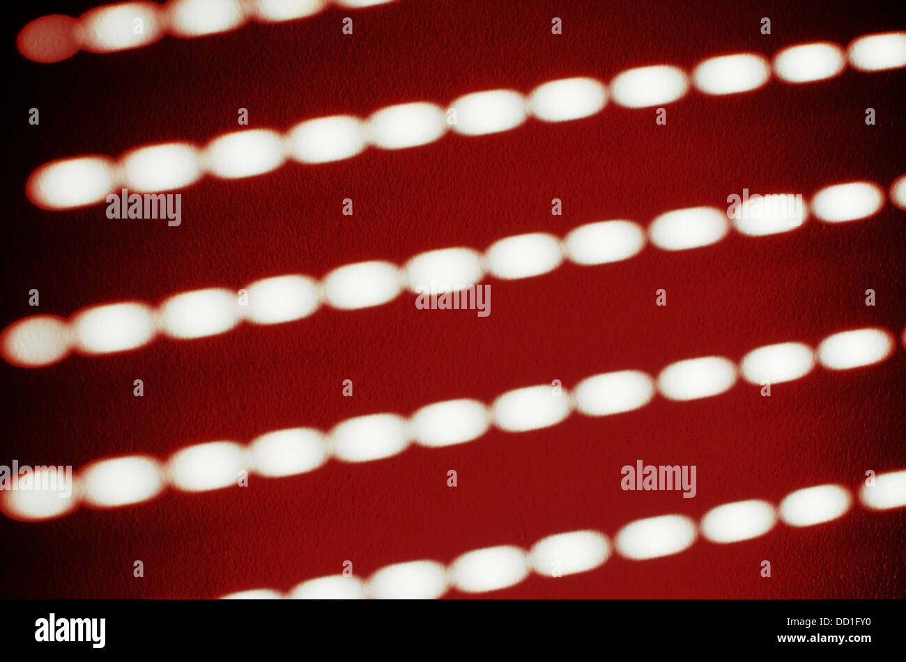 white lights on the wall, symmetrical forms Stock Photo - Alamy