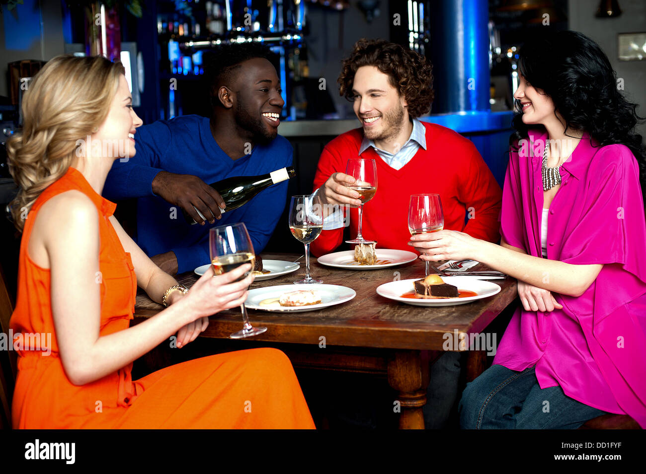 Group of party lounge friends having great time Stock Photo - Alamy
