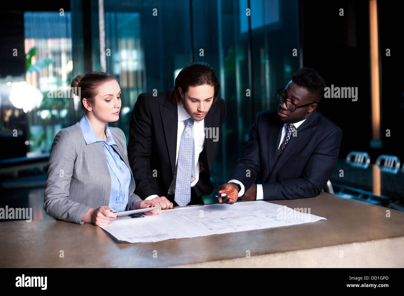 Colleagues reviewing their project together in office Stock Photo - Alamy