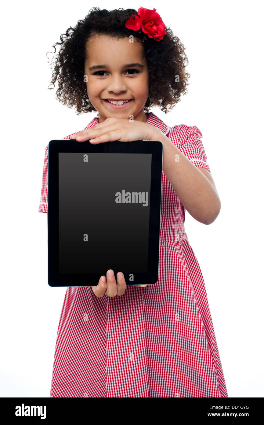 Educational tablet device being displayed by smiling school kid Stock ...