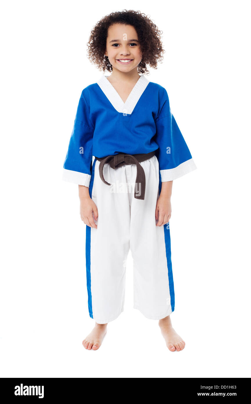 Young girl in karate uniform getting ready for practice Stock Photo - Alamy