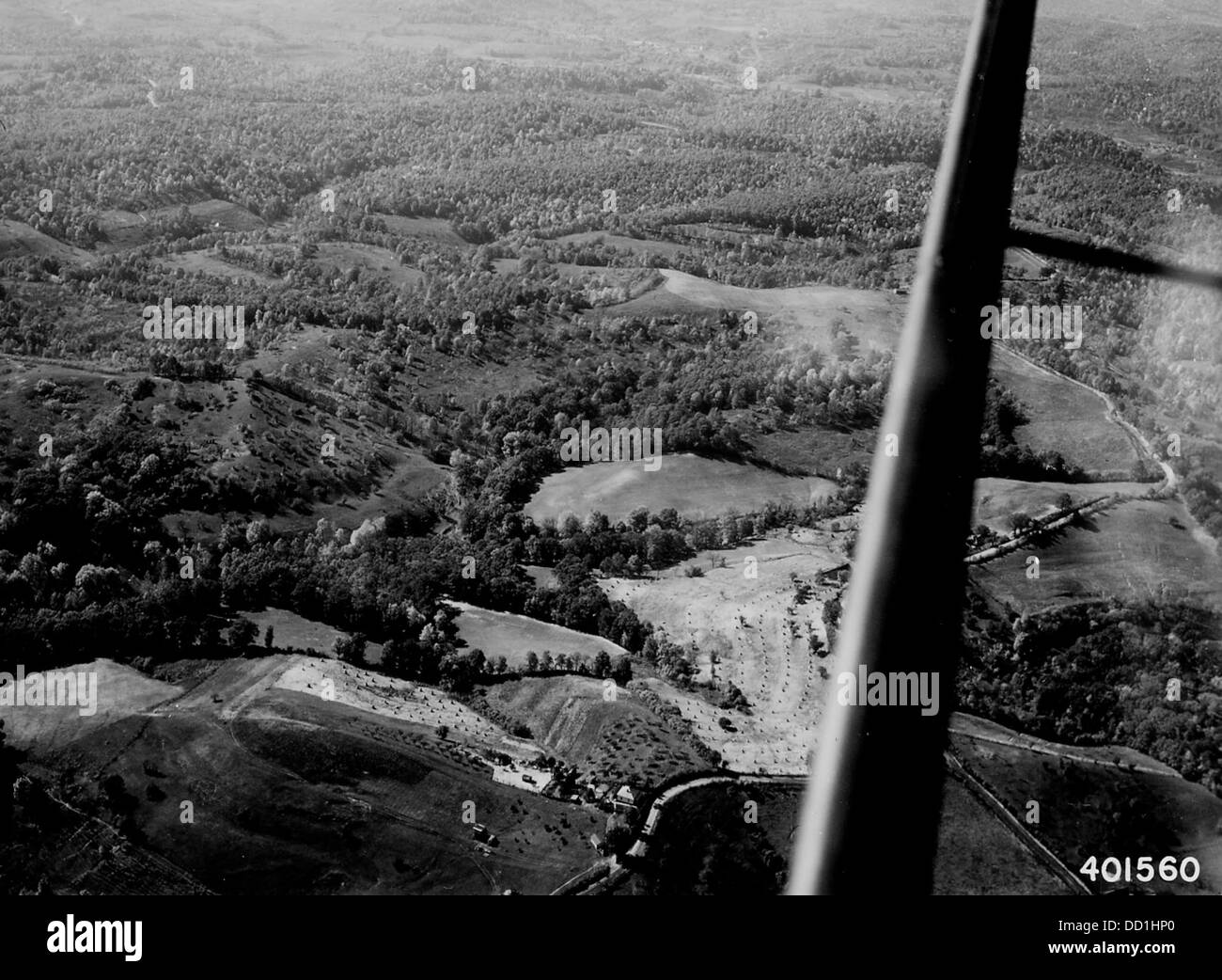 An aerial view capturing the hilly terrain of the country, highlighting ...