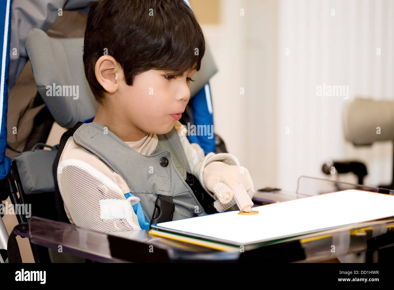 Five year old disabled boy studying in wheelchair Stock Photo - Alamy