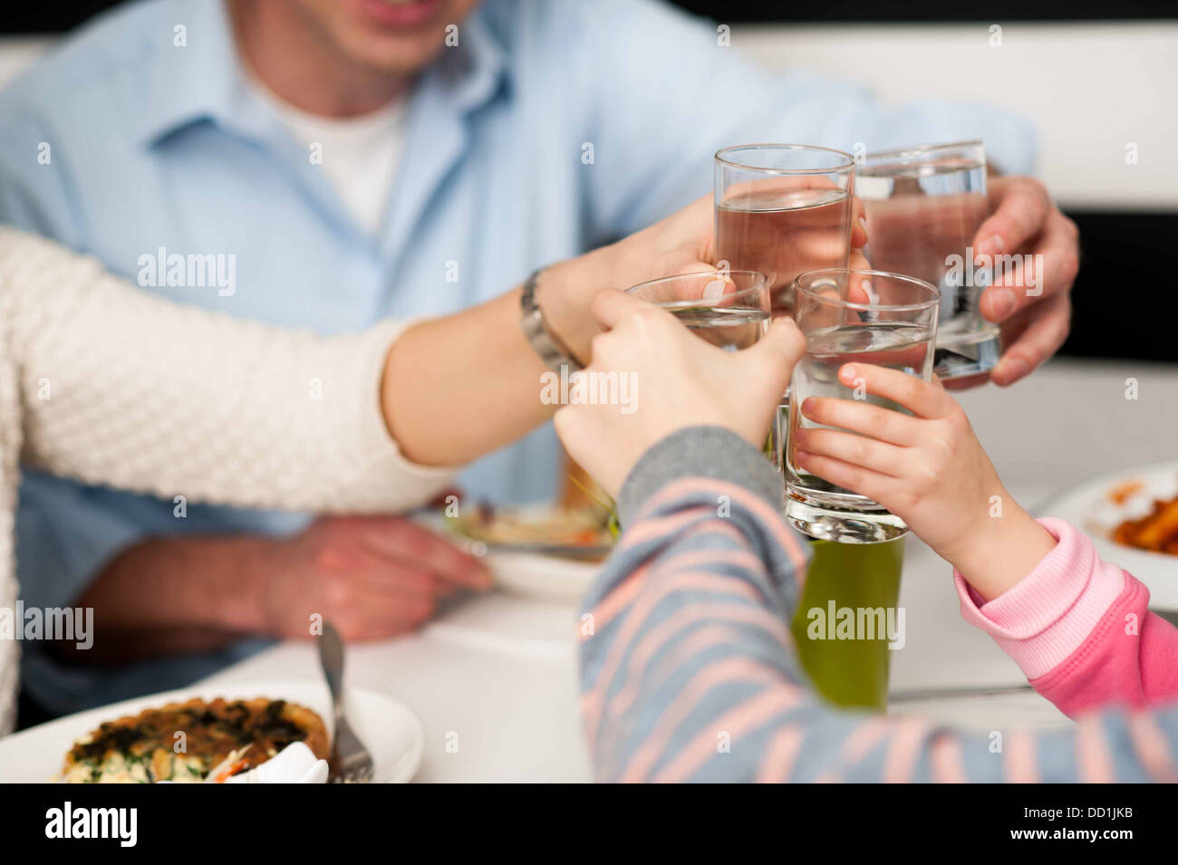 It's time to celebrate. Family toasting Stock Photo - Alamy