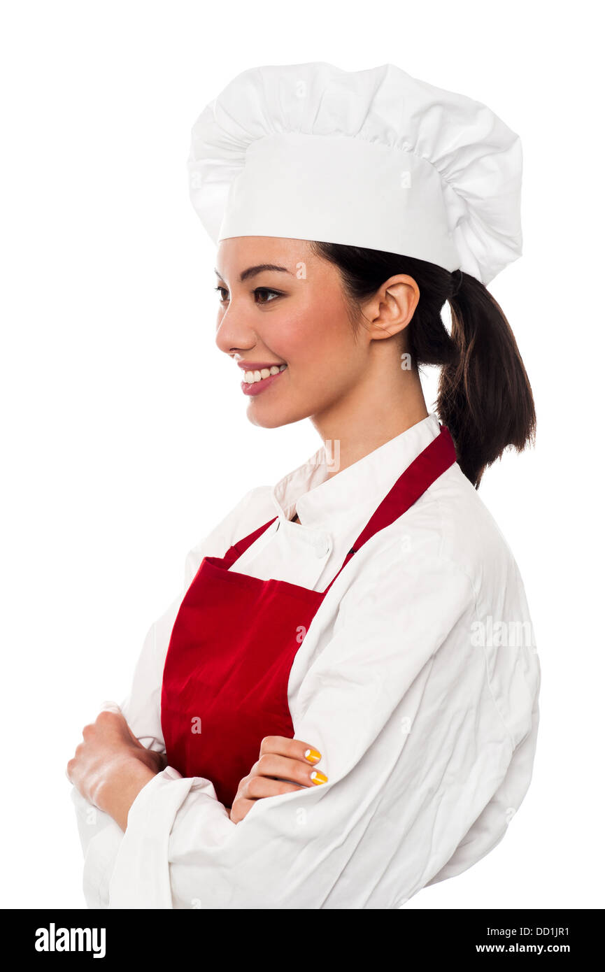 Side portrait of cute asian female chef posing with arms folded Stock ...
