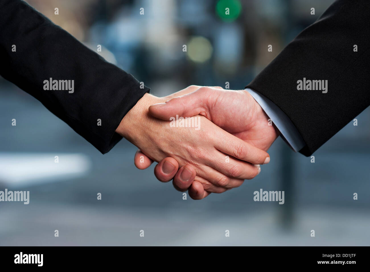 Successful business people shaking hands after closing a deal Stock ...