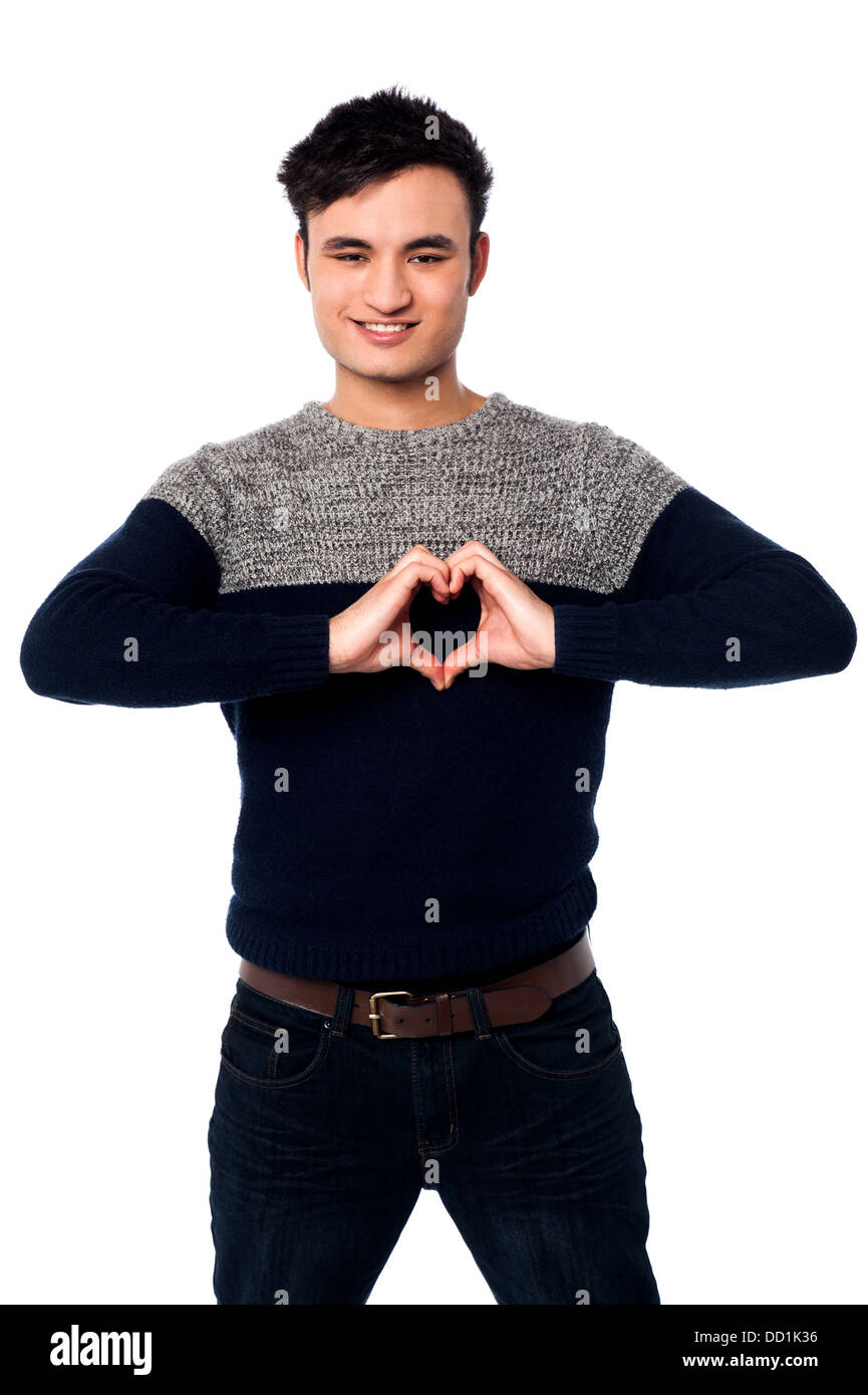 Handsome guy making heart sign with his hands Stock Photo - Alamy
