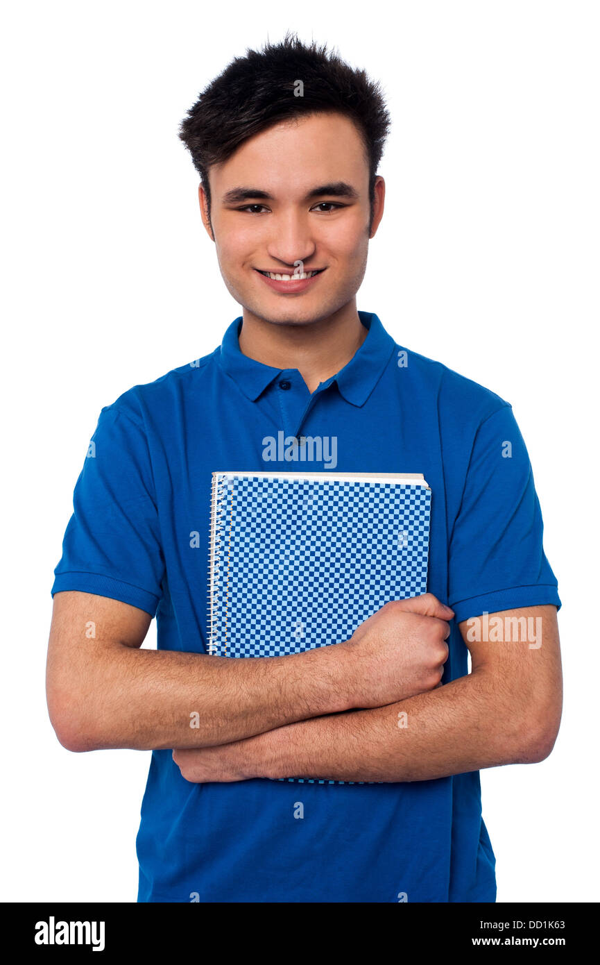 Cheerful college student holding notebook against white Stock Photo - Alamy