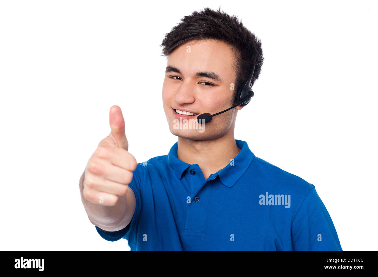Young customer service agent showing thumbs up Stock Photo - Alamy