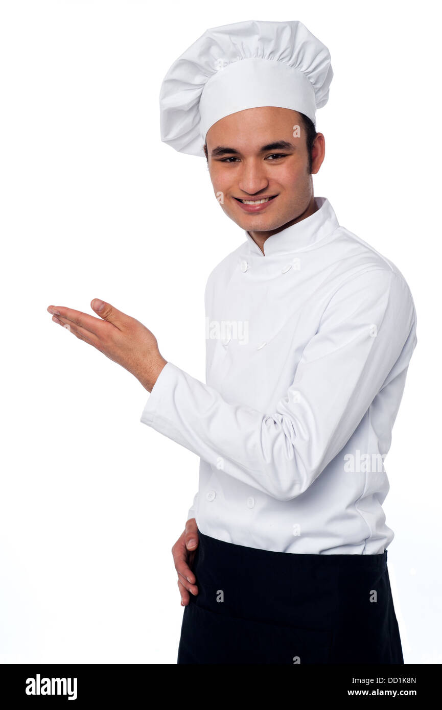 Handsome chef greeting the customers and directing them Stock Photo - Alamy