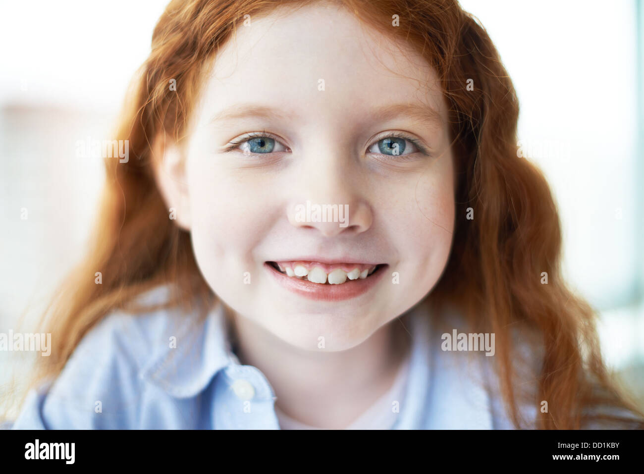 Cute little girl looking at camera with smile Stock Photo - Alamy