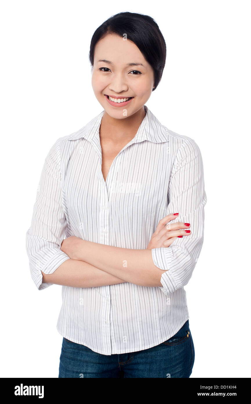 Attractive young girl with a radiant smile, arms crossed Stock Photo ...