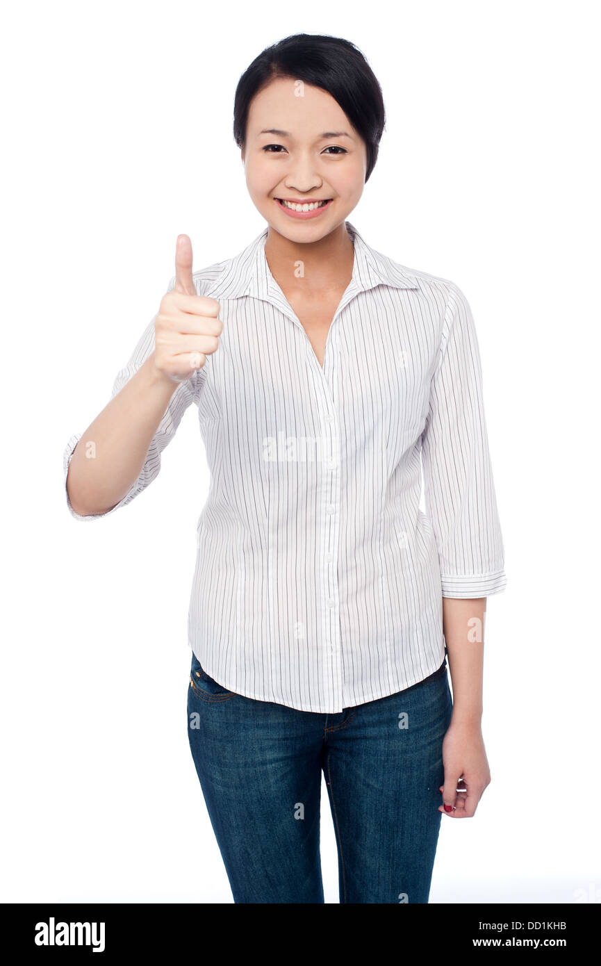 Beautiful smiling girl showing thumbs up gesture Stock Photo - Alamy