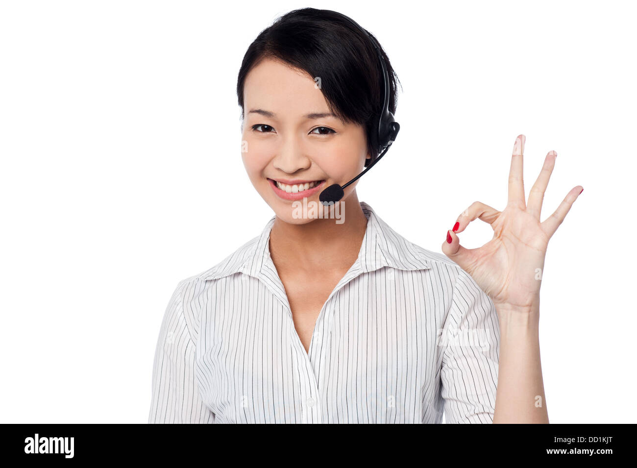 Smiling support staff showing fantastic gesture Stock Photo - Alamy