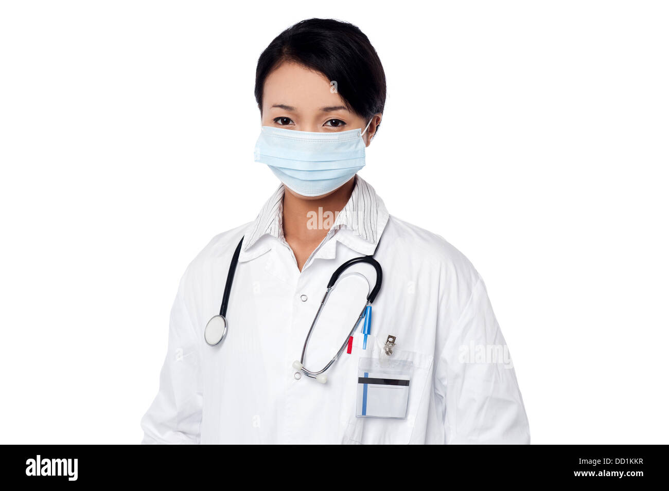 Young female physician covering her face with surgical mask Stock Photo ...