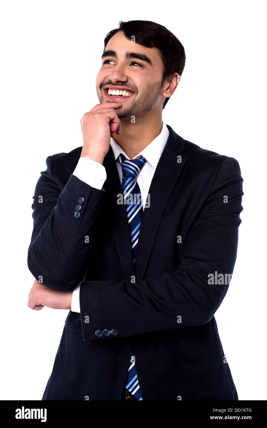 Smiling corporate man thinking something Stock Photo - Alamy