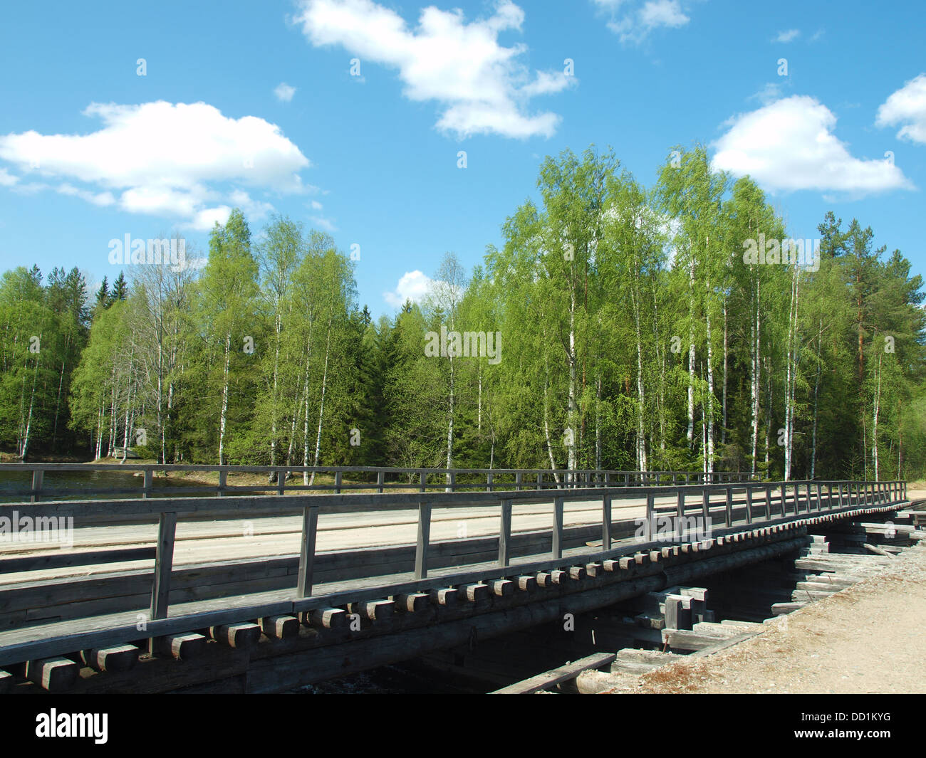 Wooden bridge across river Stock Photo - Alamy