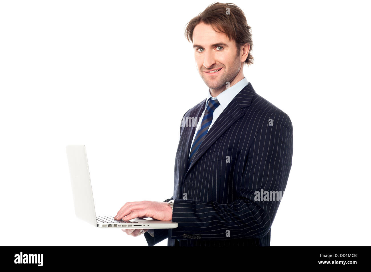 Young businessman operating his laptop Stock Photo - Alamy