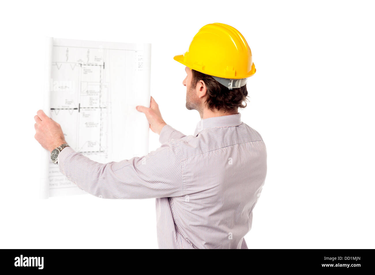Civil engineer analyzing construction plan Stock Photo - Alamy