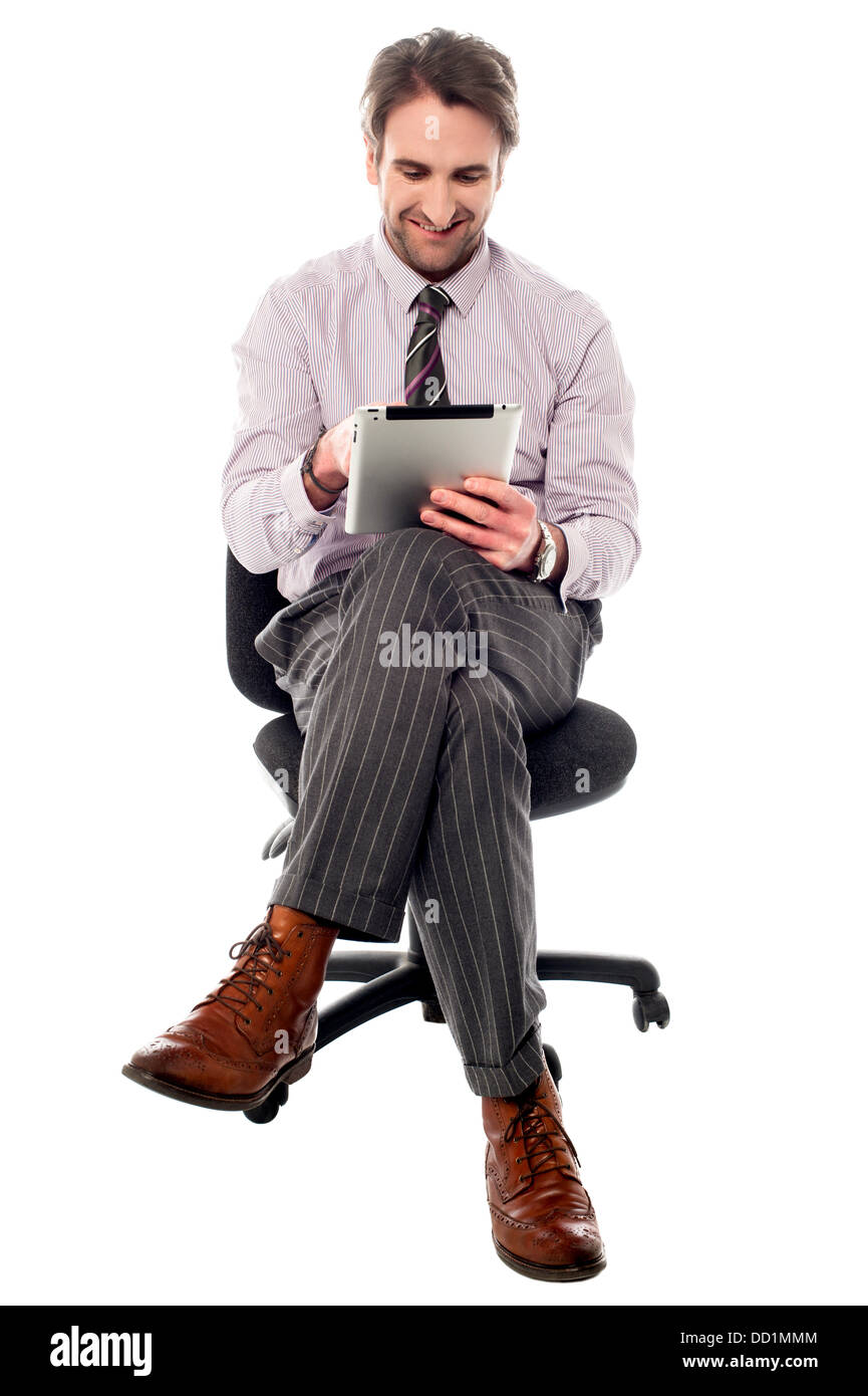 Smart business executive operating tablet pc Stock Photo - Alamy