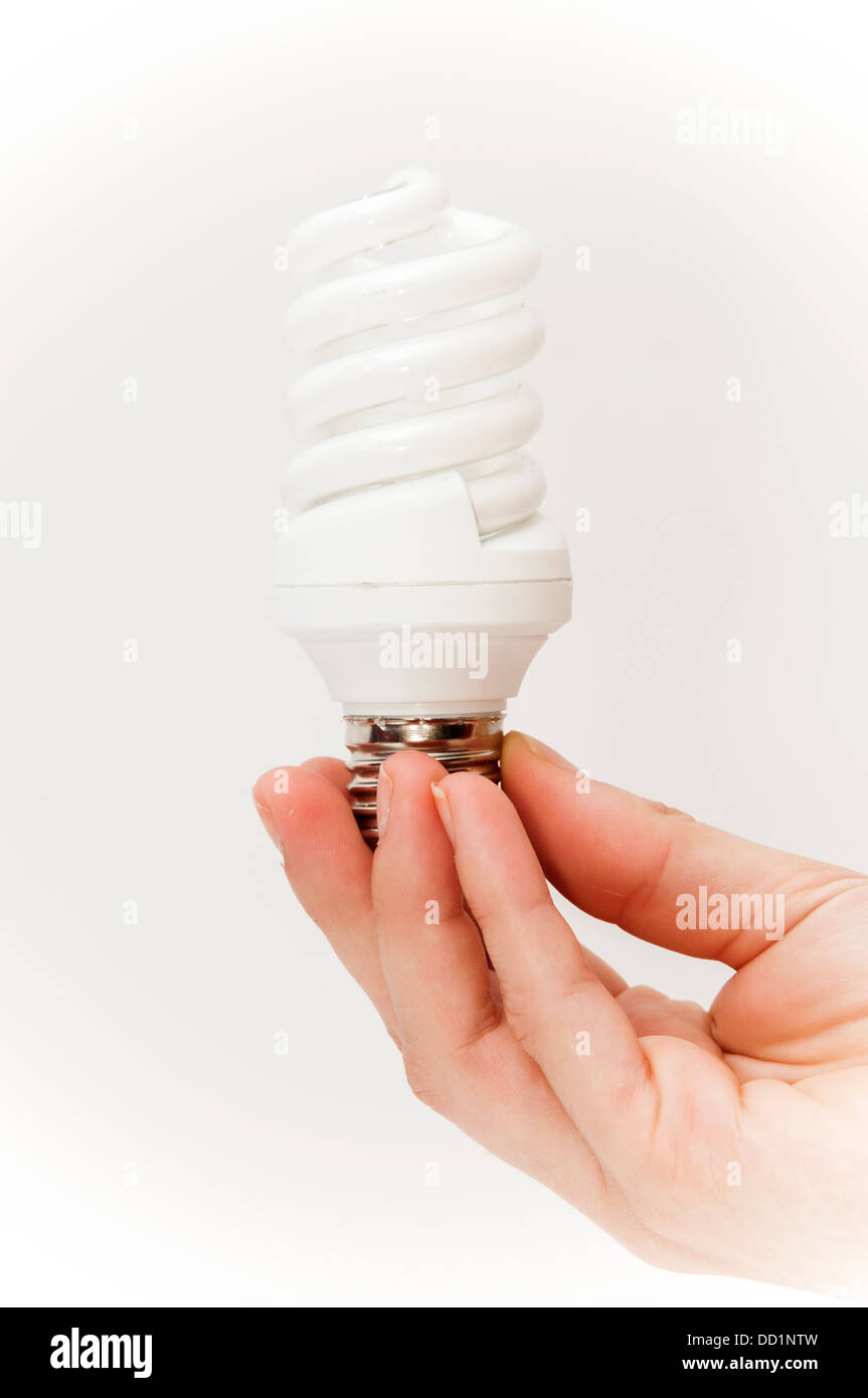 hand with lightbulb on a white background Stock Photo - Alamy