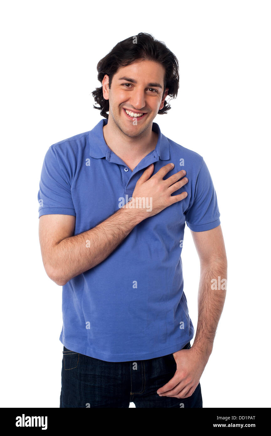 Handsome caucasian male resting hand on his chest Stock Photo - Alamy