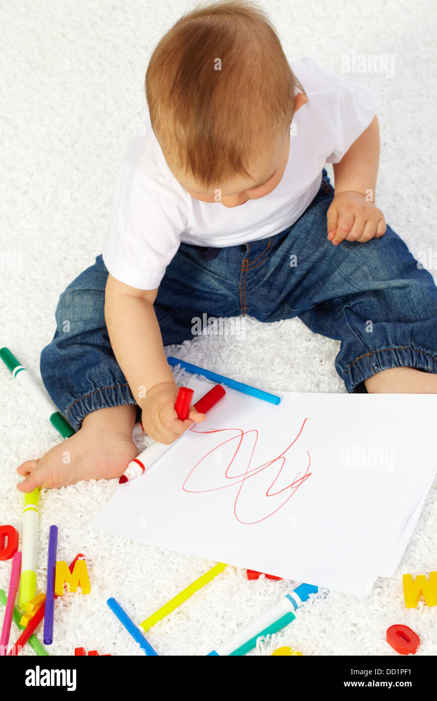 Image of cute little boy drawing with crayons Stock Photo - Alamy