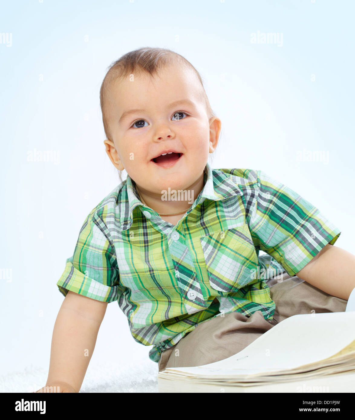 Portrait of happy boy with open book over white background Stock Photo ...