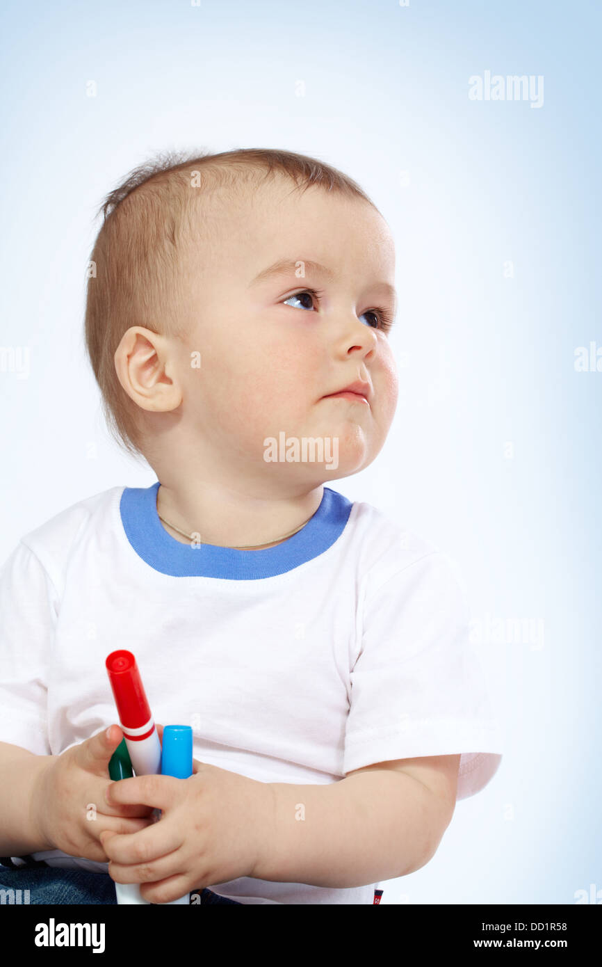 Portrait of calm child with crayons over white background Stock Photo ...
