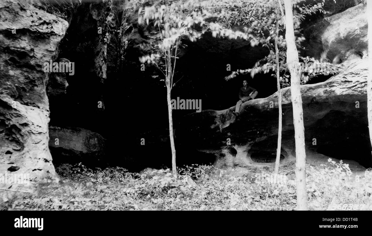 This image depicts a cavern located in a bluff, showcasing the natural ...