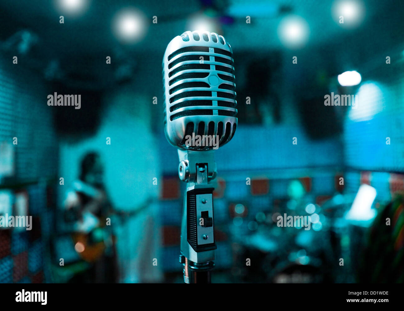 Microphone and musicians Stock Photo - Alamy